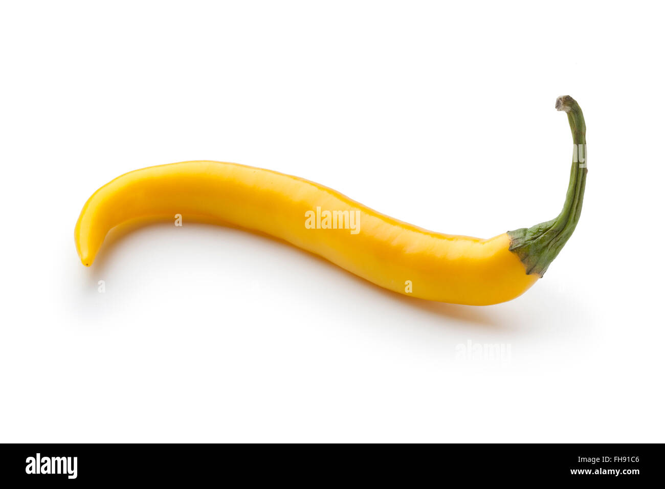 One single fresh yellow hot chili pepper on white background Stock ...