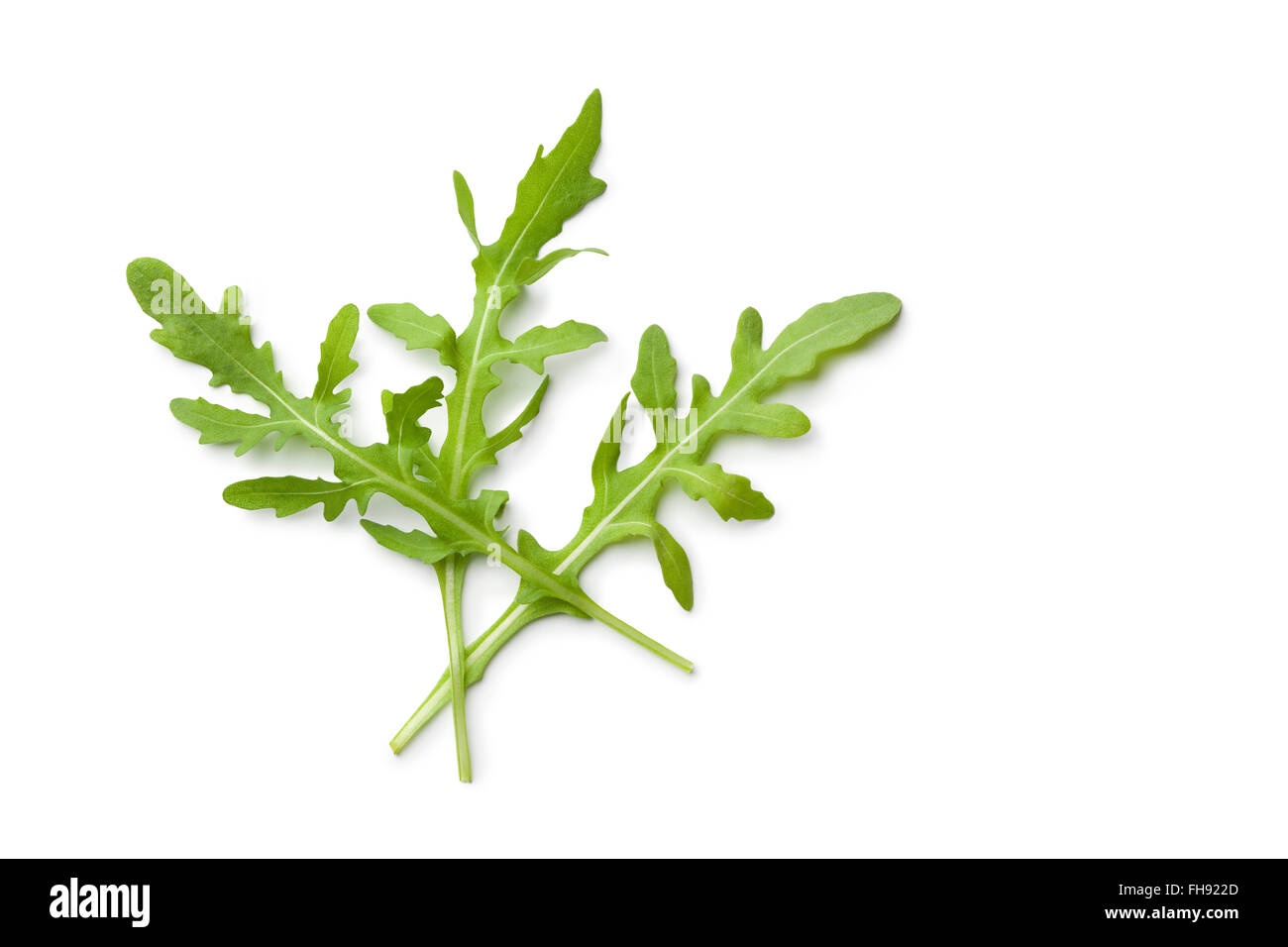 Fresh raw Arugula leaves on white background Stock Photo - Alamy