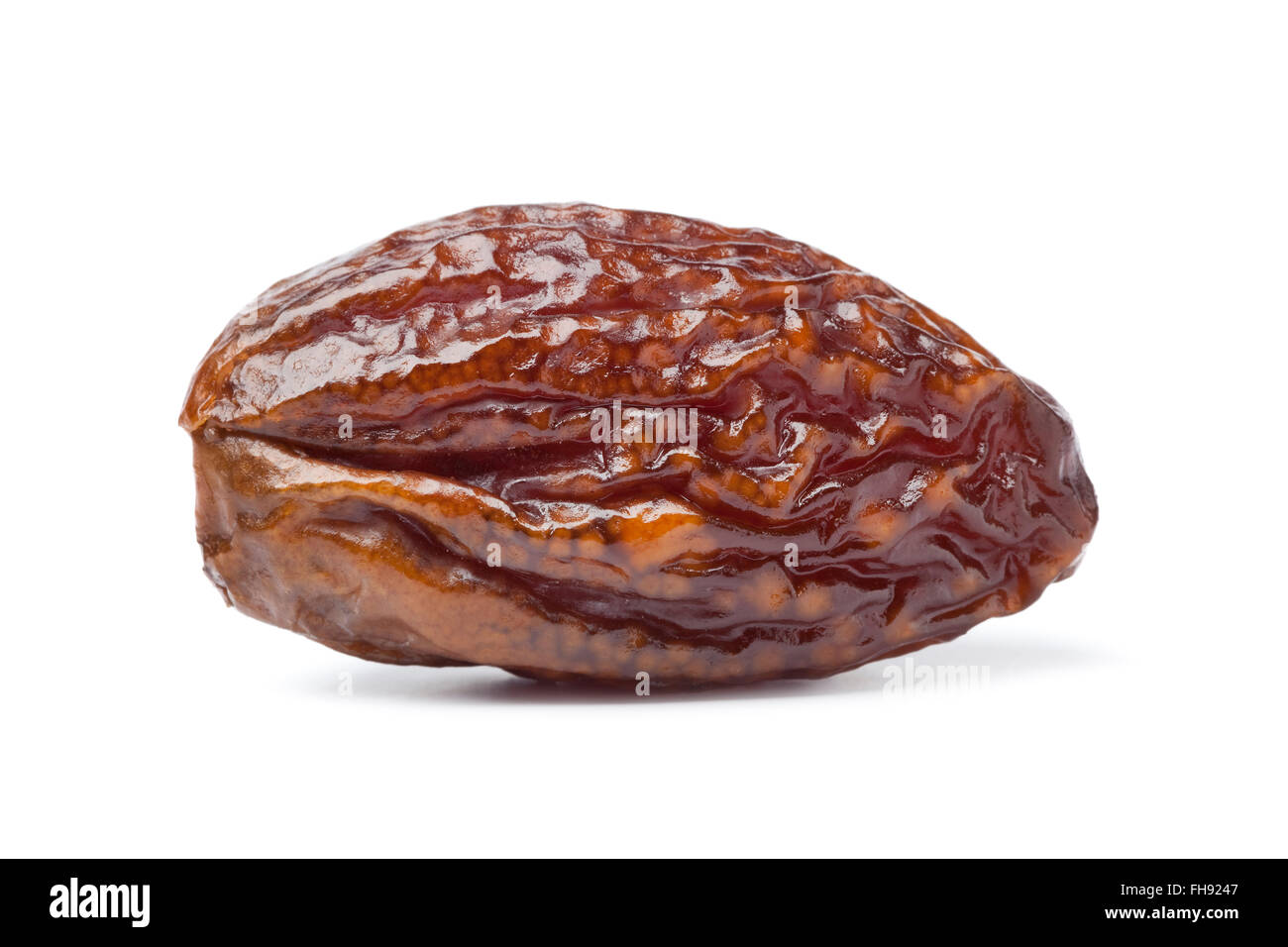Whole single dried date on white background Stock Photo - Alamy