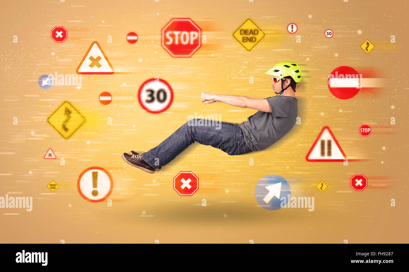 Young driver with road signs around him Stock Photo - Alamy