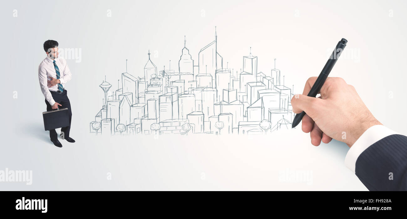 Businessman looking at hand drawn city on wall Stock Photo - Alamy