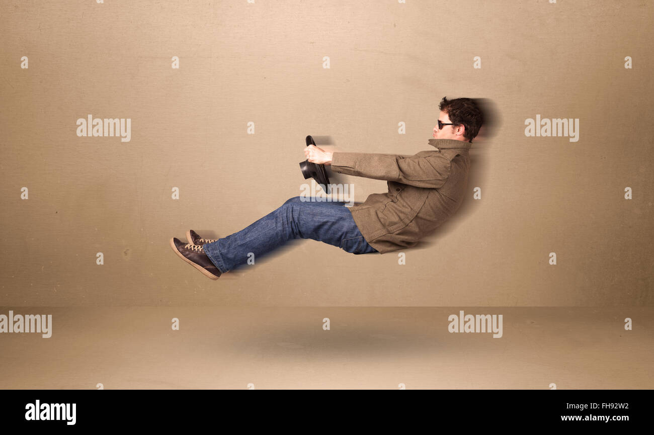 Happy funny man driving a flying car concept Stock Photo - Alamy