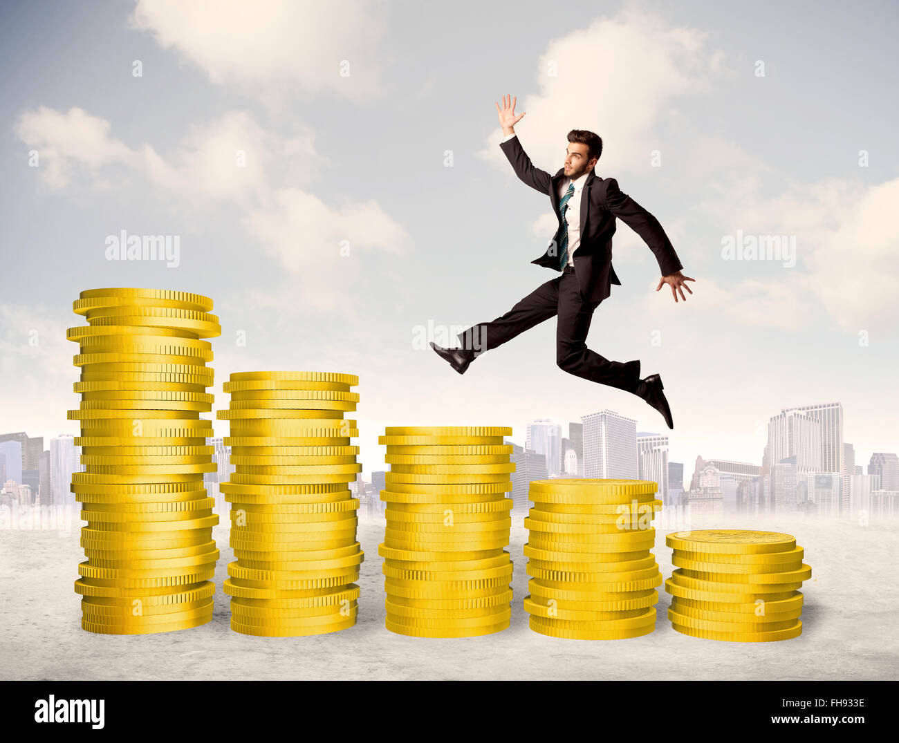 Successful business man jumping up on gold coin money Stock Photo - Alamy