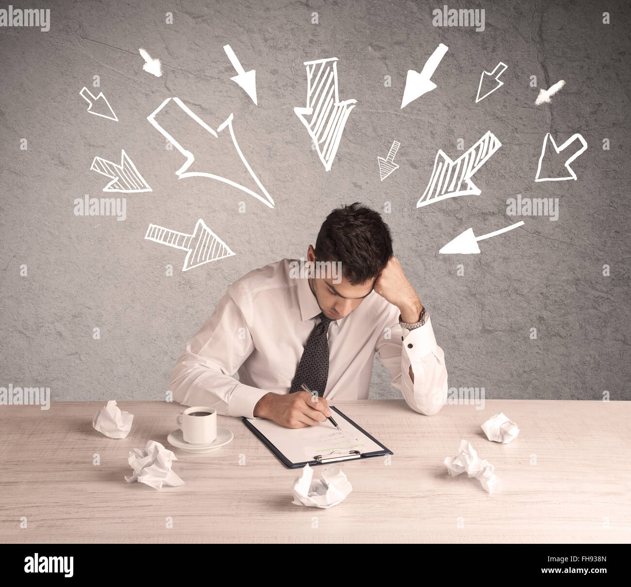 Busy office worker with drawn arrows Stock Photo - Alamy