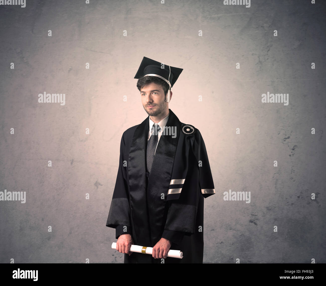 Portrait of a young graduate student on grungy background Stock Photo ...