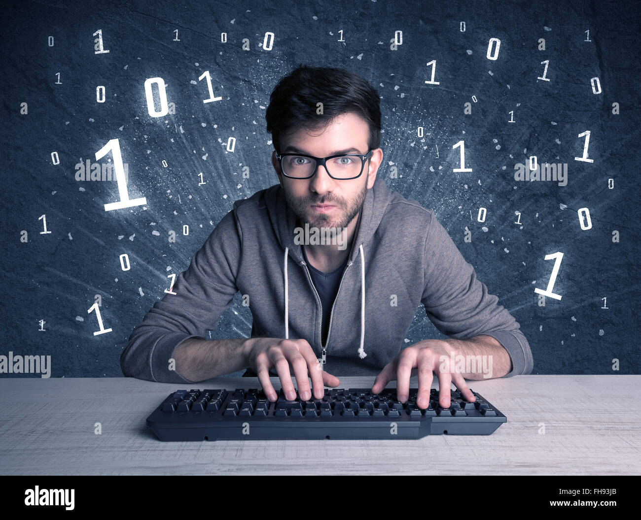 Online intruder geek guy hacking codes Stock Photo - Alamy