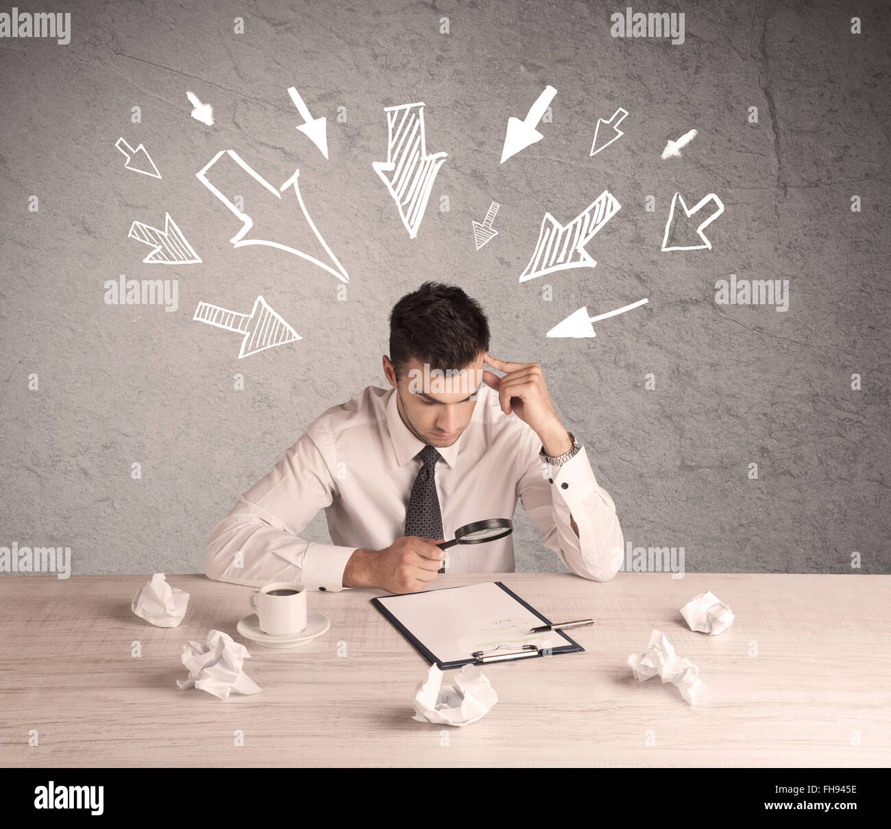 Busy office worker with drawn arrows Stock Photo - Alamy