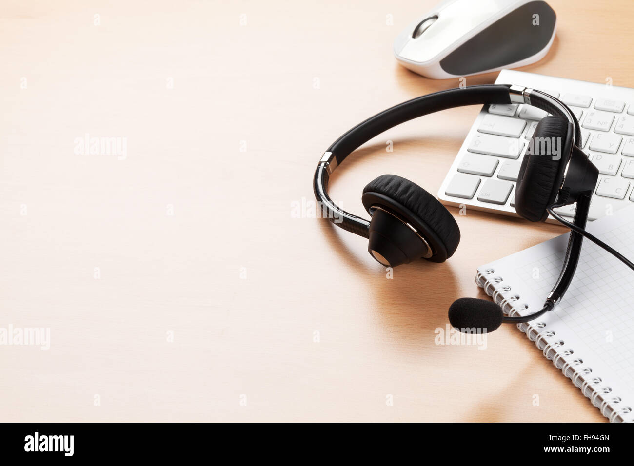 Office desk with headset and pc. Call center support table. Veiw with ...