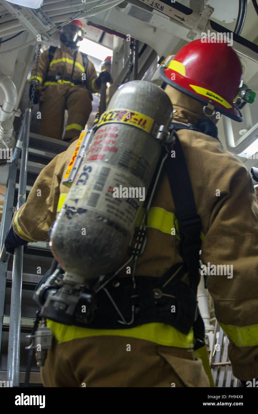 A U.S. Navy general quarters drill aboard the USS Farragut, emphasizing ...