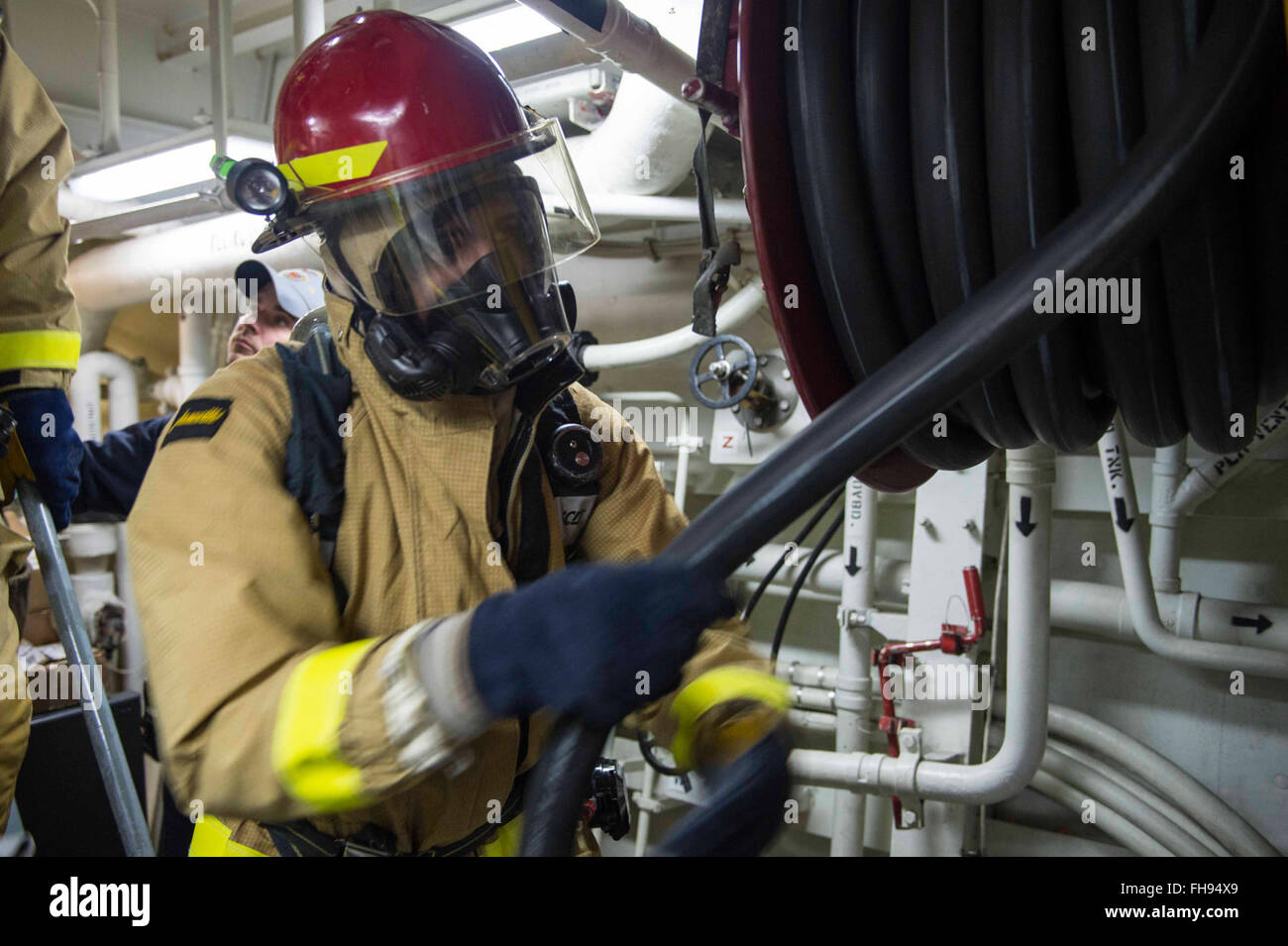 A U.S. Navy general quarters drill aboard the USS Farragut, focusing on ...