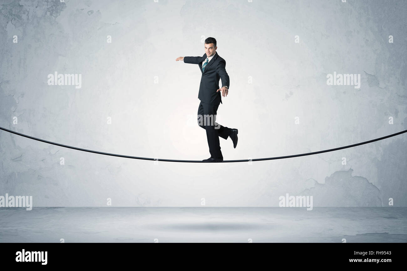 Businessman balancing on tightrope people hi-res stock photography and ...