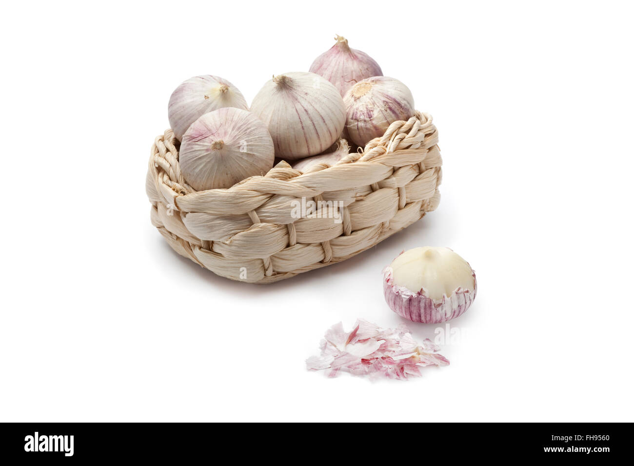 Basket with whole fresh single clove garlic on white background Stock ...
