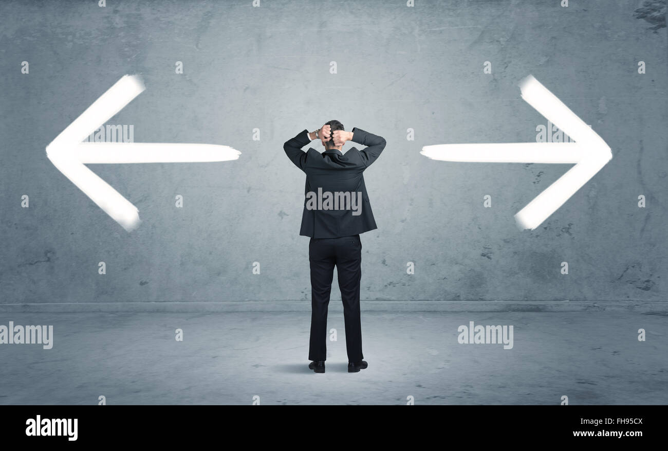 Confused business person choosing the way Stock Photo - Alamy