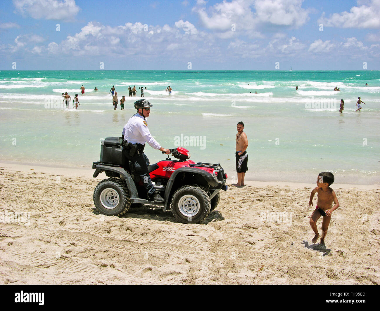 Miami, Florida, USA - May 28, 2007: A policeman on patrol, riding his ...
