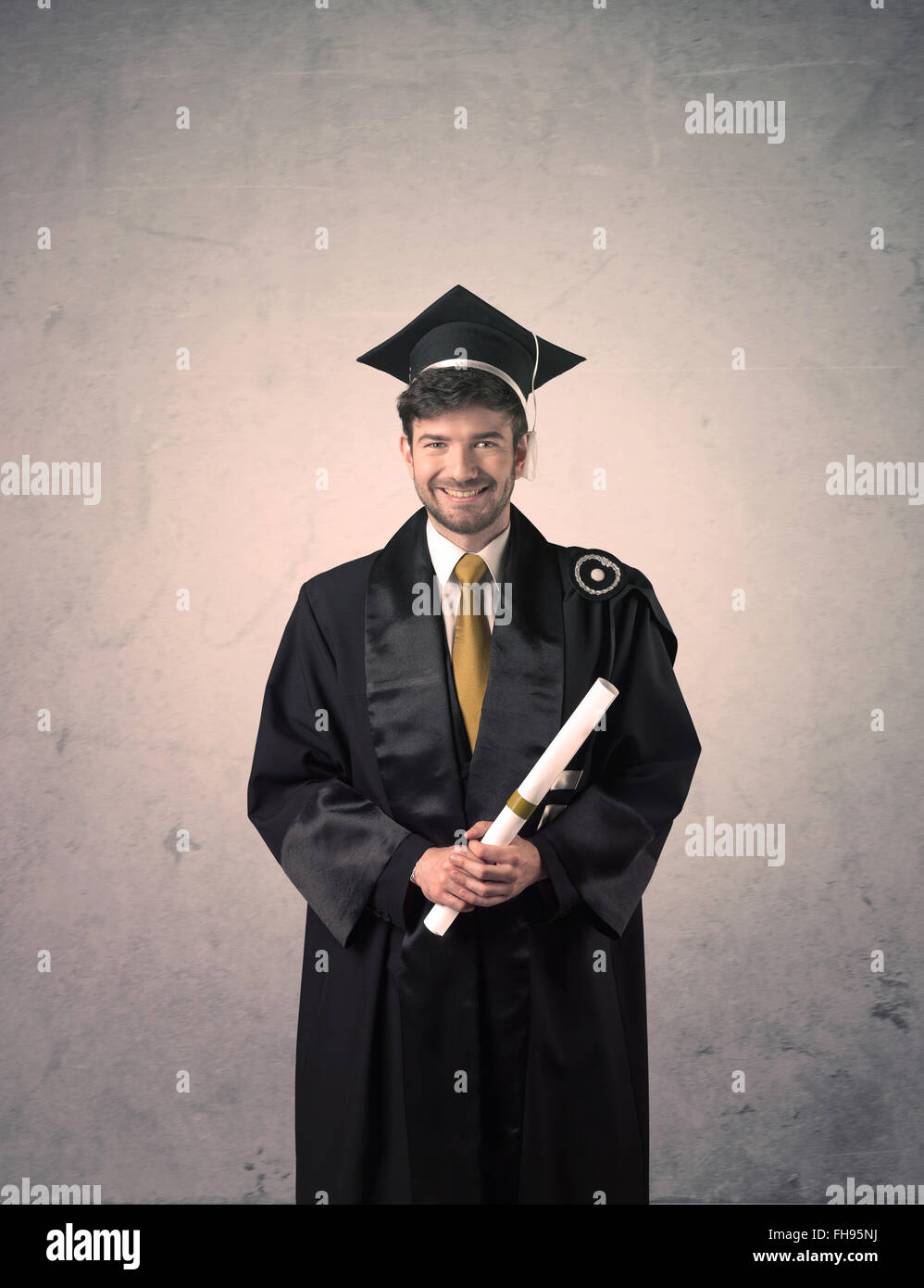 Portrait of a young graduate student on grungy background Stock Photo ...