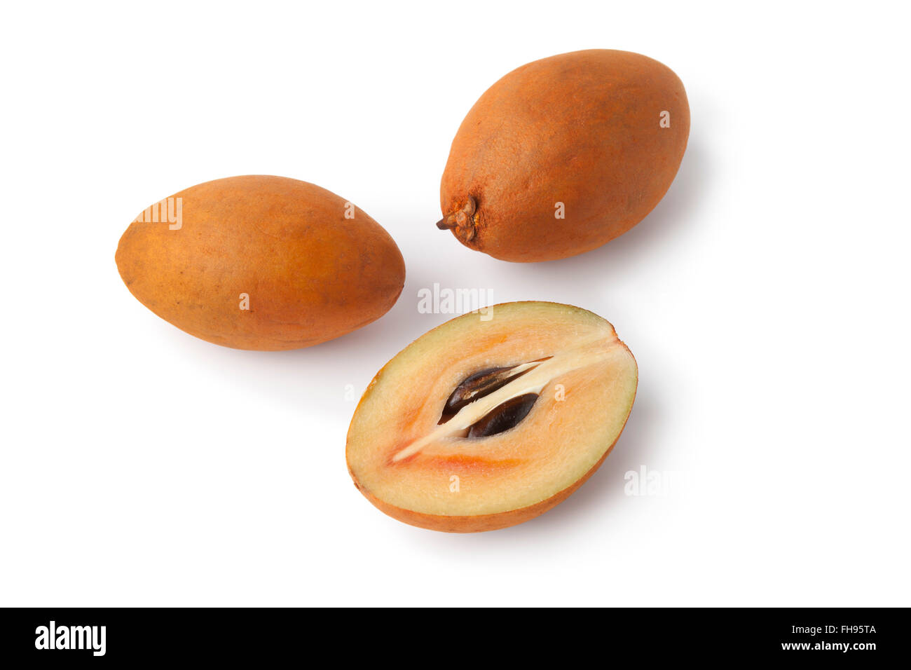 Whole and partial fresh sapodilla isolated on white background Stock ...
