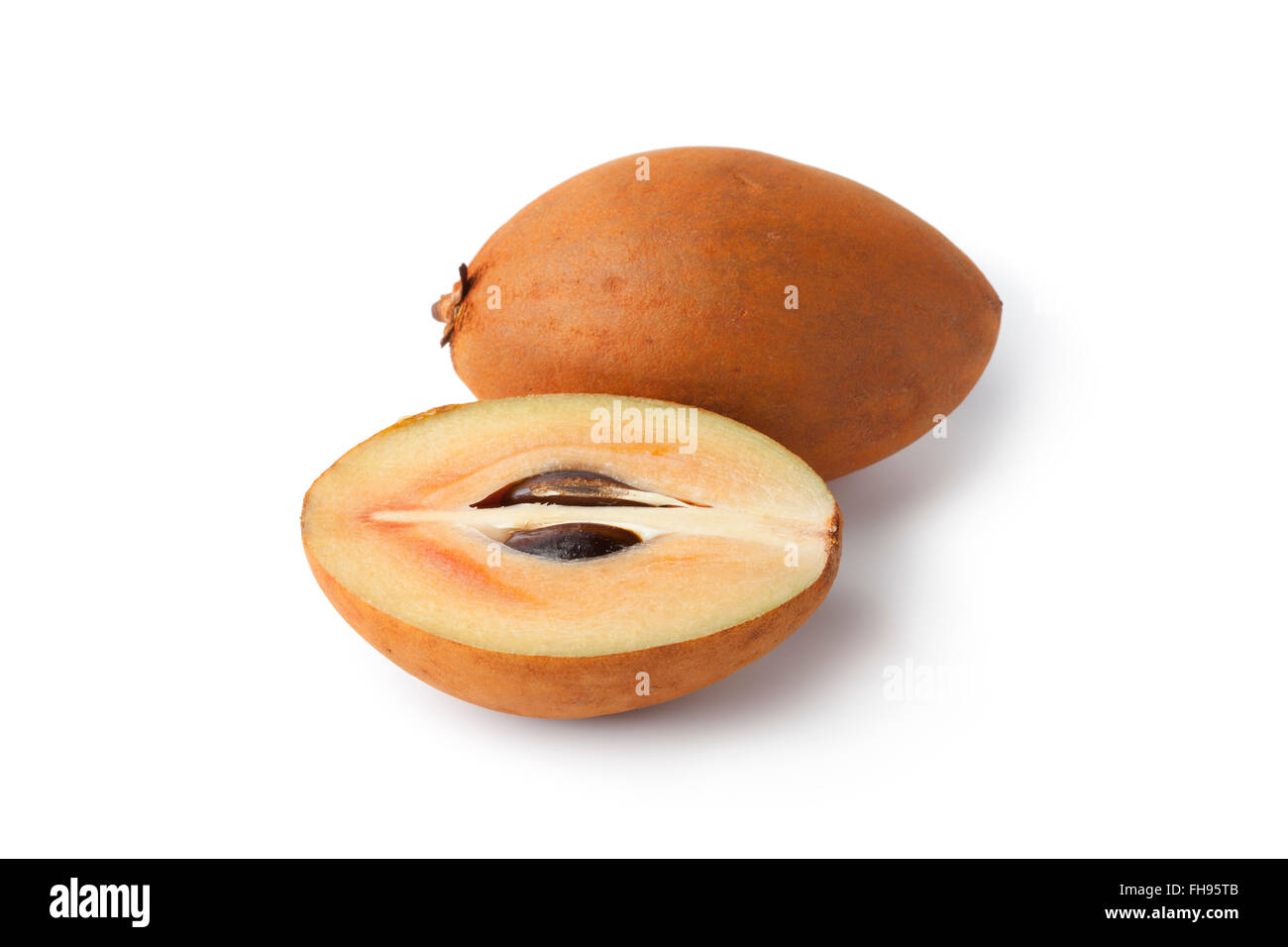 Whole and partial fresh sapodilla isolated on white background Stock ...