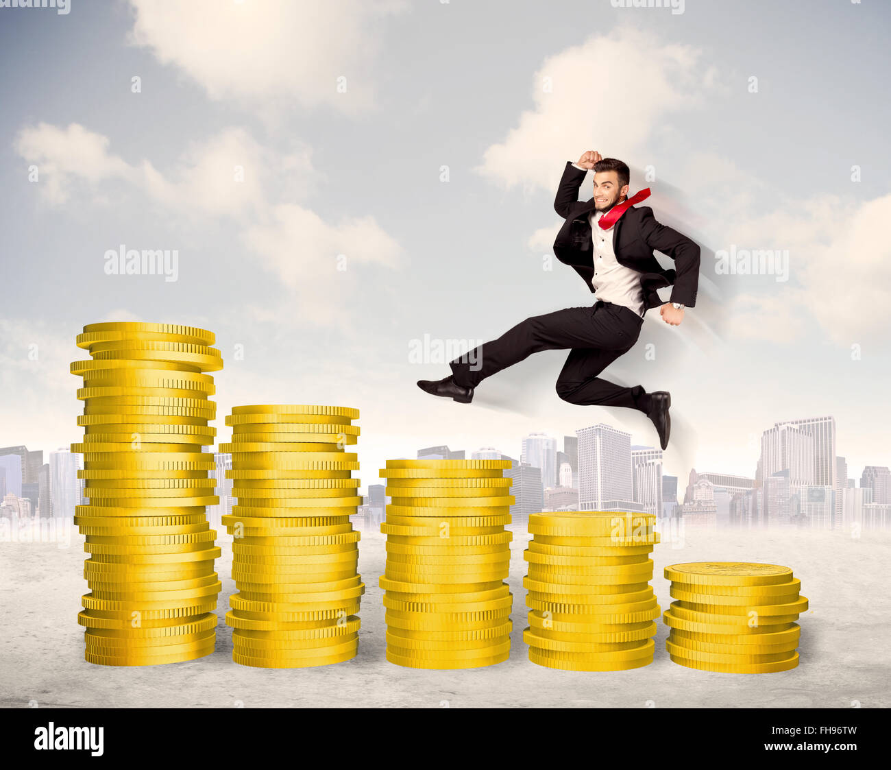 Successful business man jumping up on gold coin money Stock Photo - Alamy