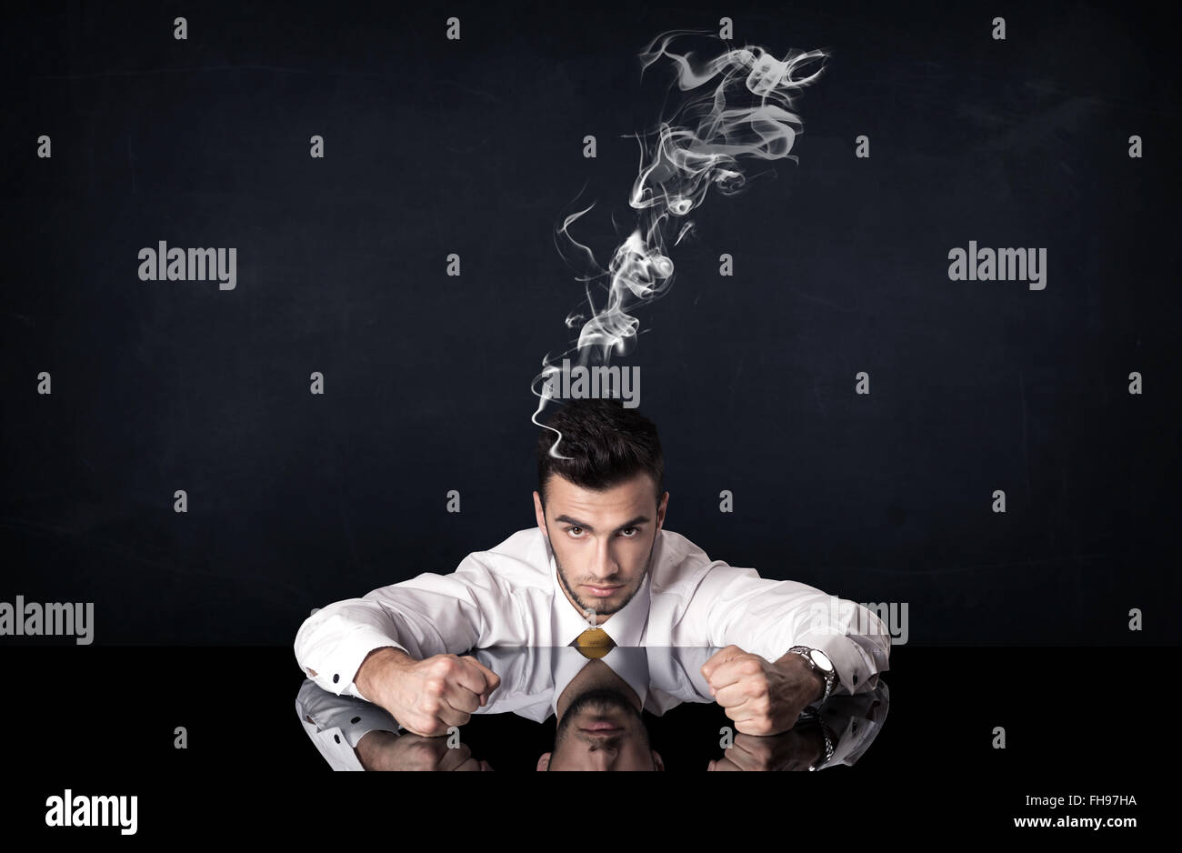 Depressed businessman with smoking head Stock Photo - Alamy
