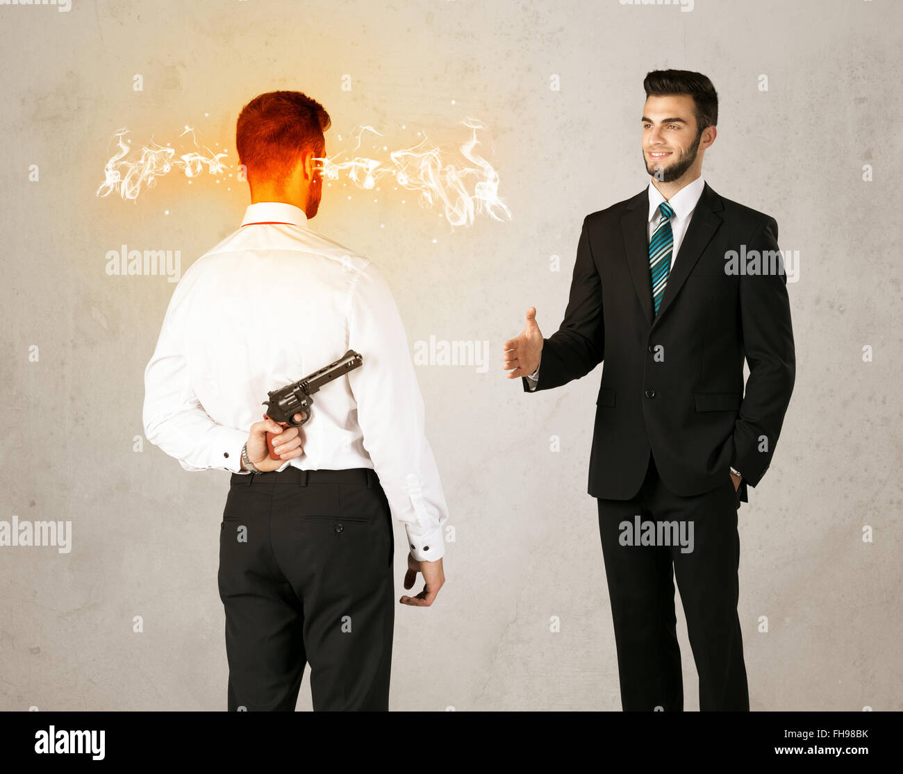 Angry businessman with weapon Stock Photo - Alamy