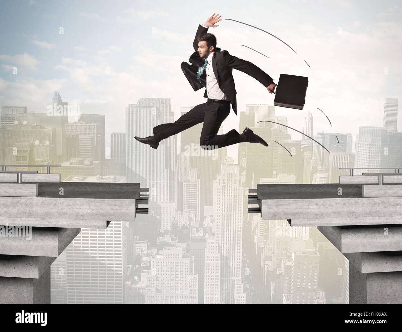 Energetic business man jumping over a bridge with gap Stock Photo - Alamy