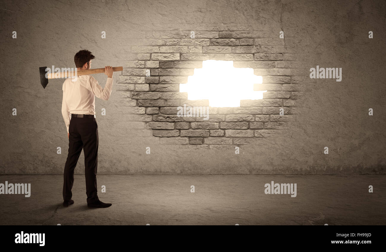 Businessman breaking the wall with hammer hi-res stock photography and ...