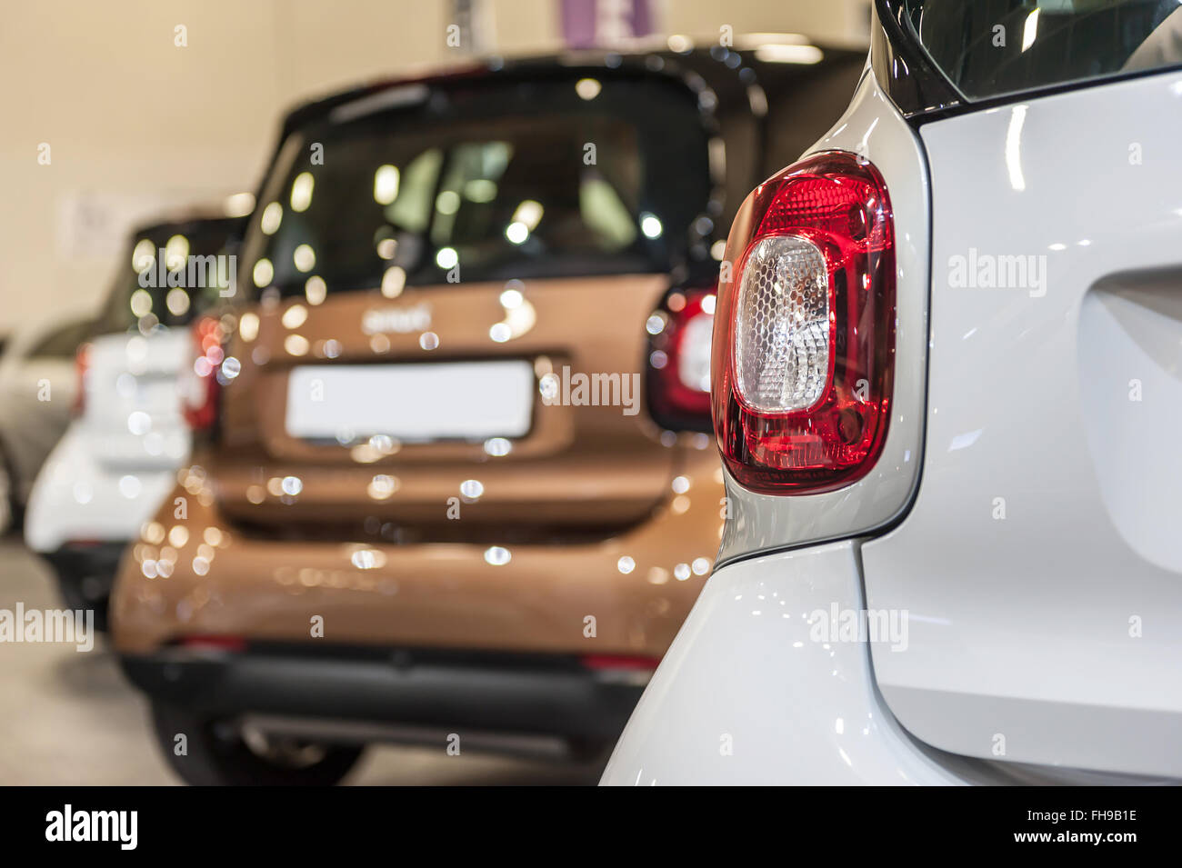 Rear view of city cars in a salon Stock Photo - Alamy