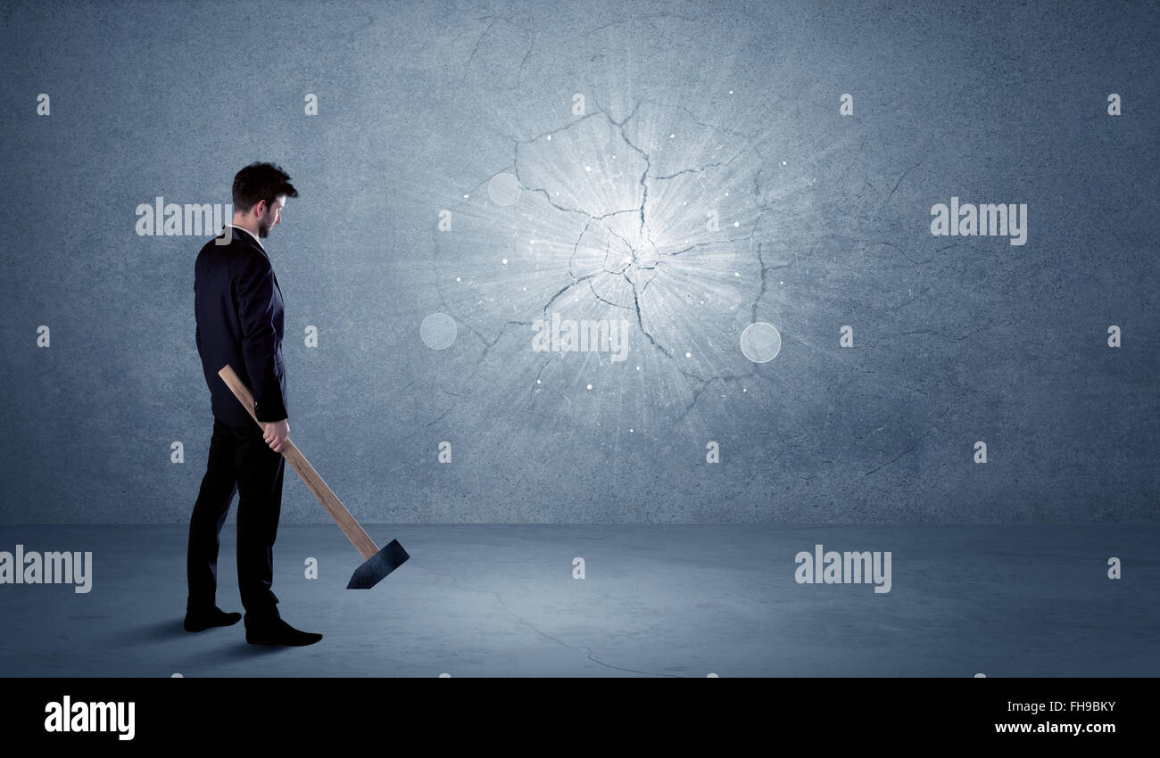 Business man hitting wall hammer hi-res stock photography and images ...