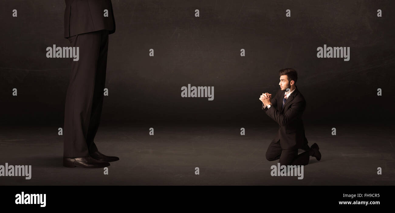 Huge man with small businessman standing at front concept Stock Photo ...