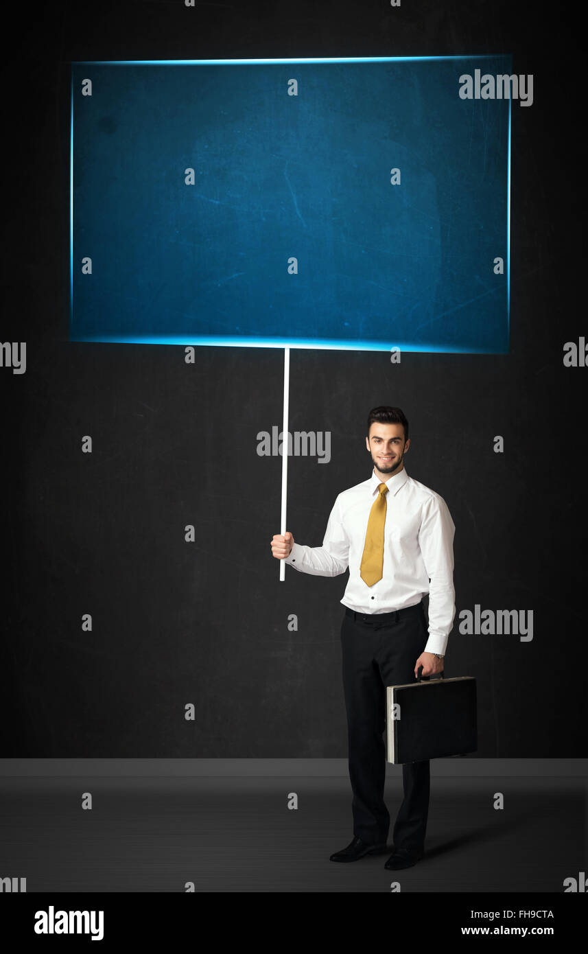 Businessman with blue board Stock Photo - Alamy