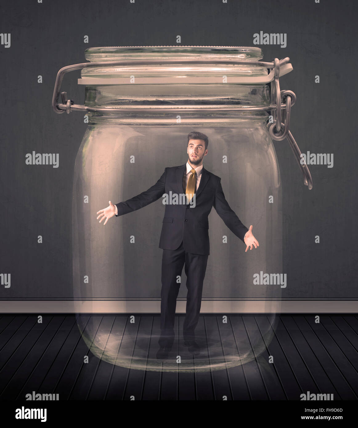 Businessman trapped into a glass jar concept Stock Photo - Alamy