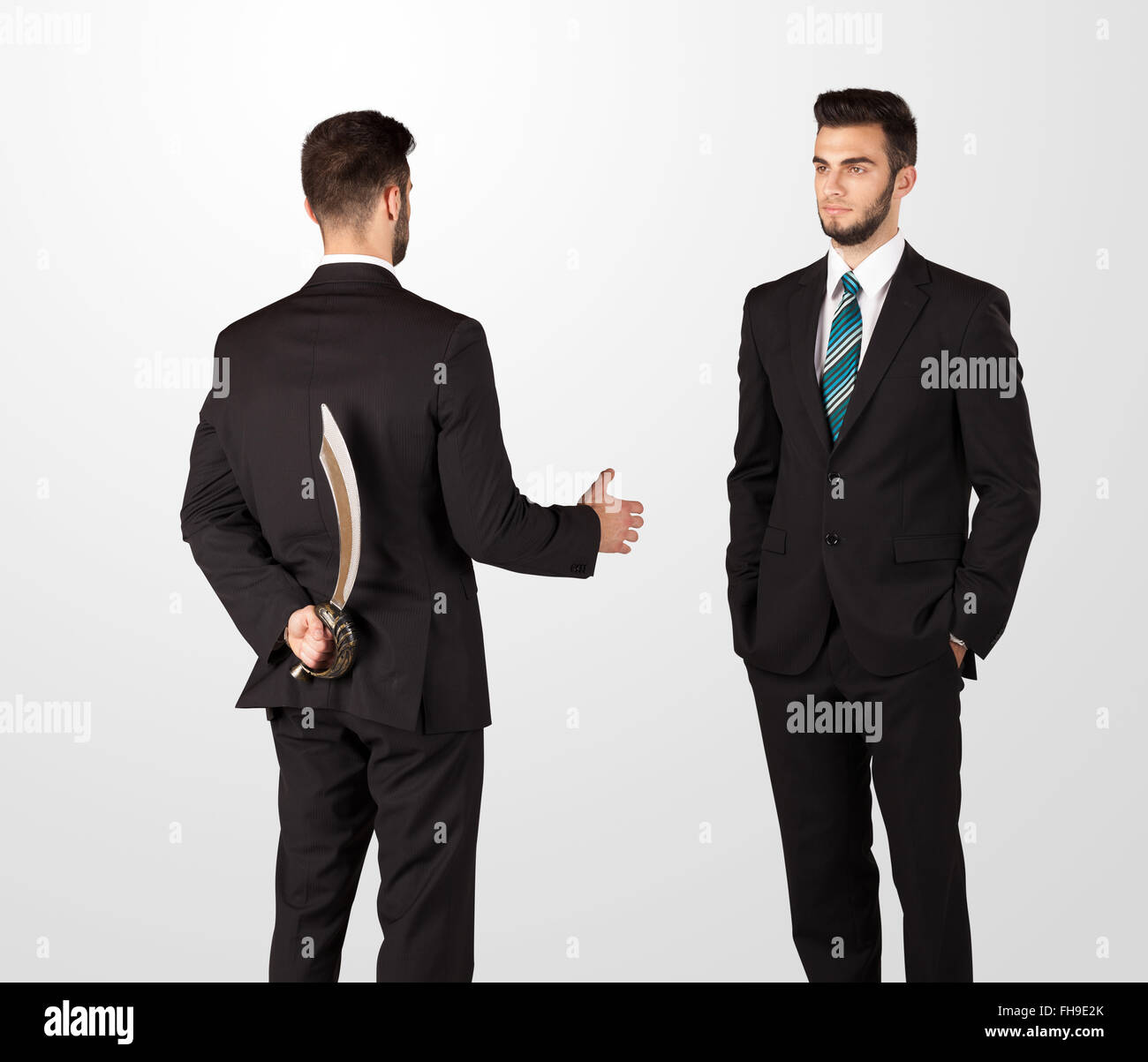 Two businessman shake hands Stock Photo - Alamy