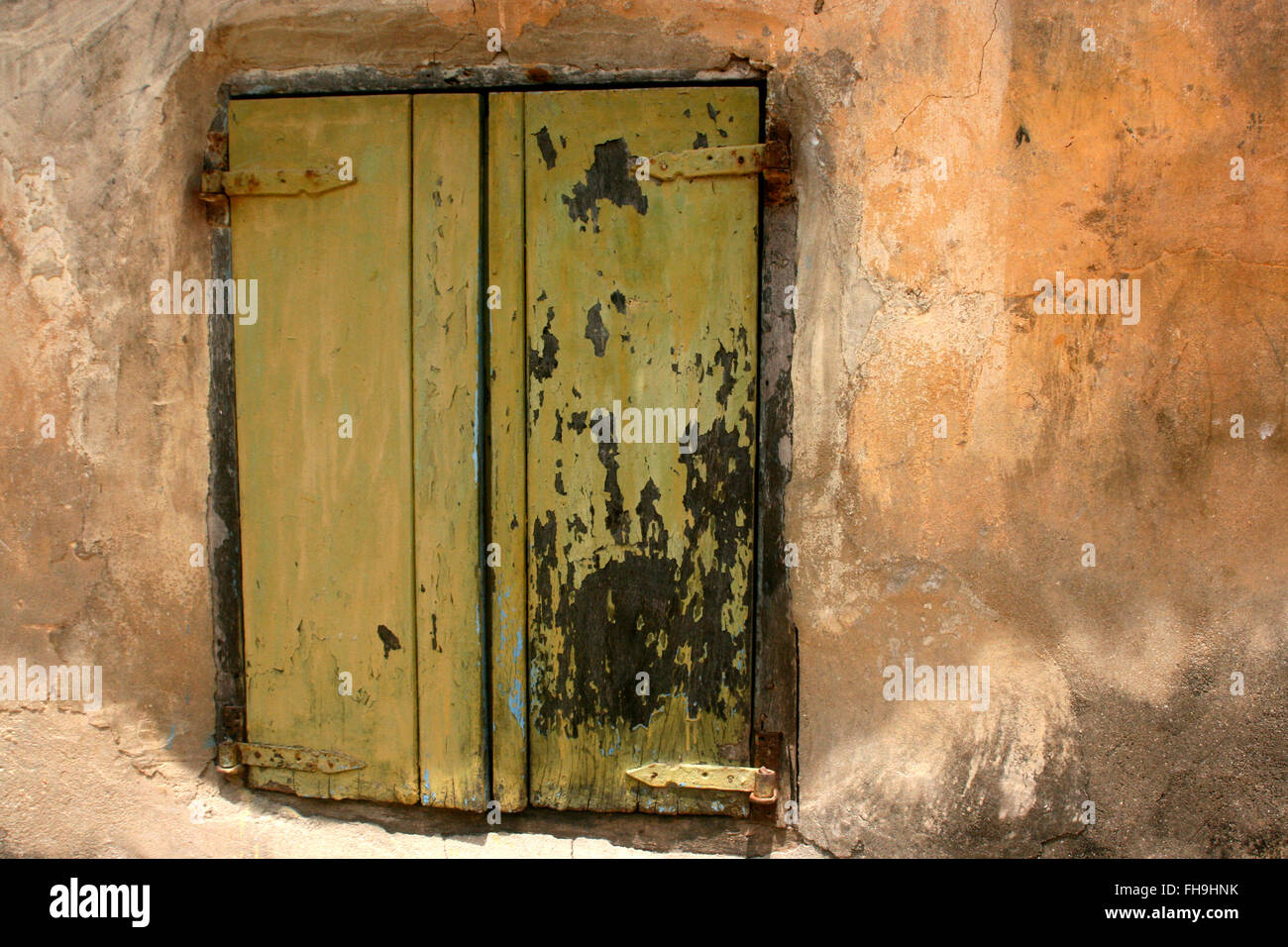 Shuttered window on derelict building Stock Photo - Alamy