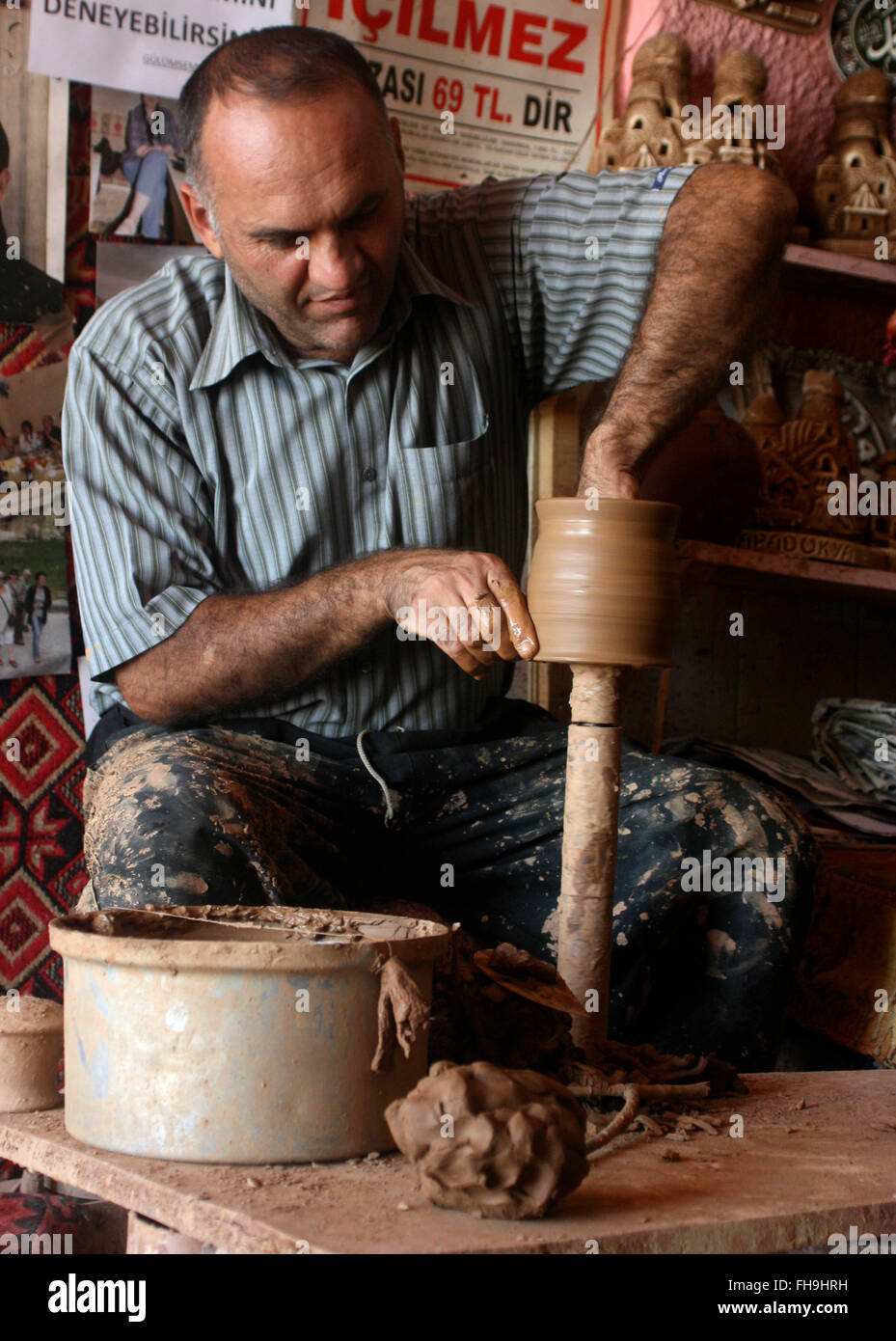 Turkish potter working on wheel in his shop Stock Photo - Alamy
