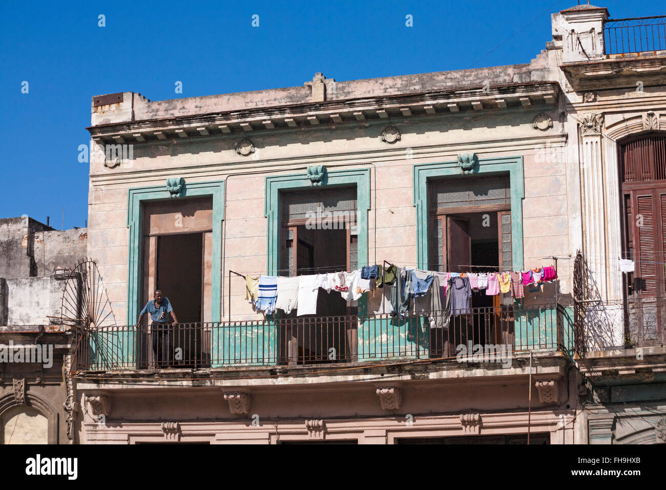 Man hanging out washing hi-res stock photography and images - Alamy