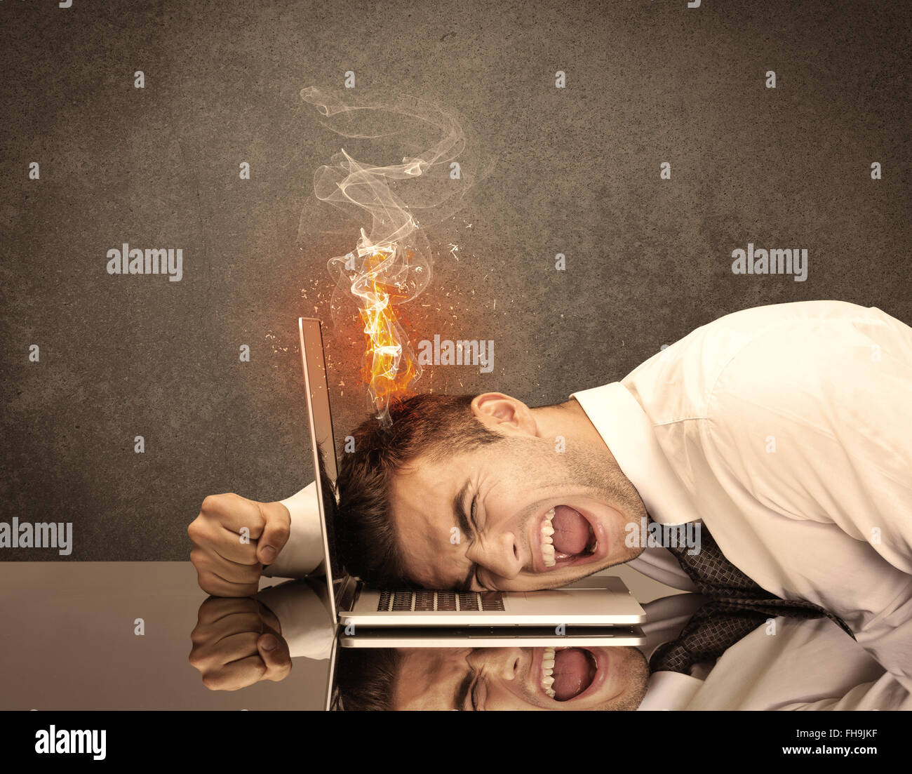 Sad business person's head catching fire Stock Photo - Alamy