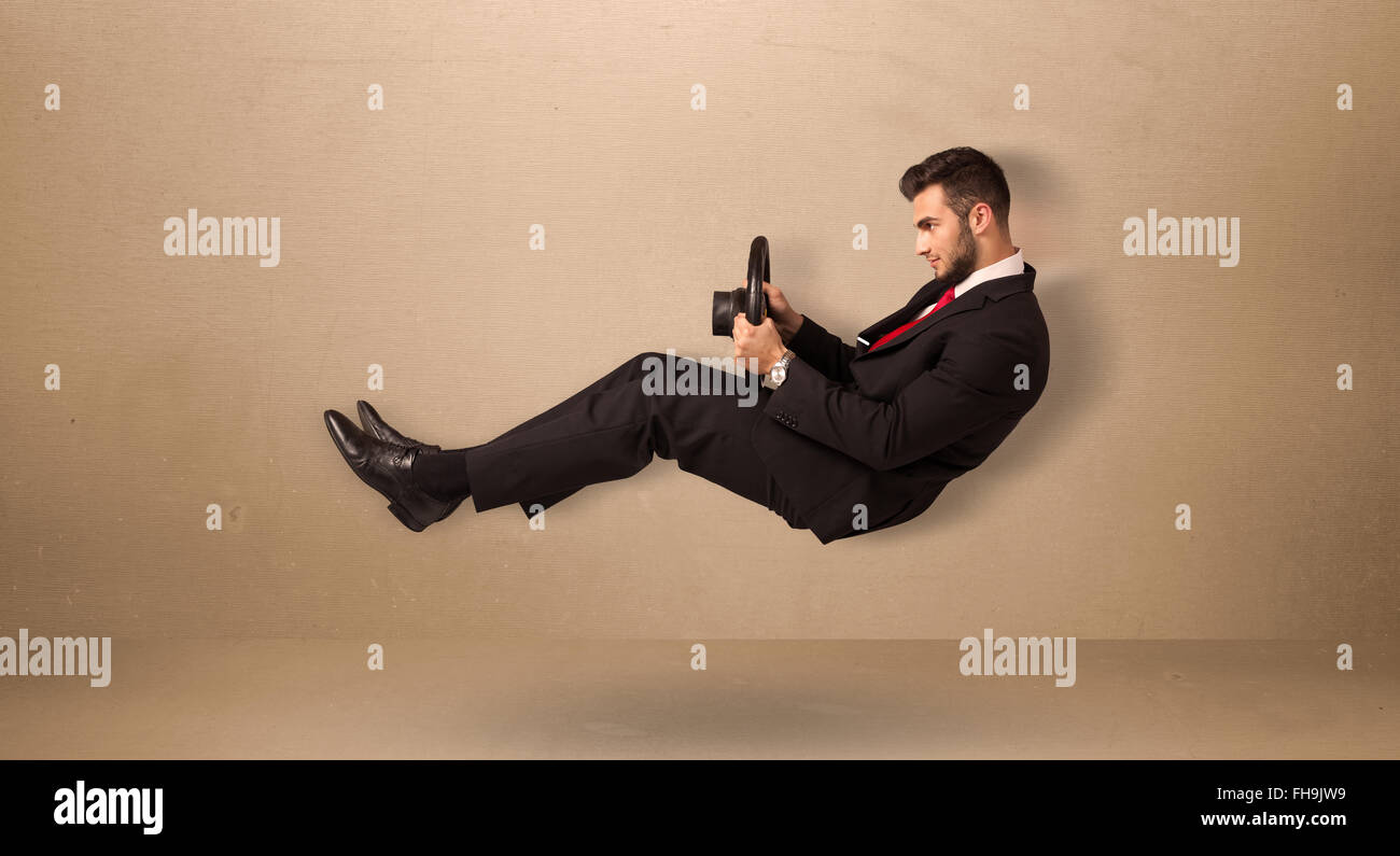 Happy funny man driving a flying car concept Stock Photo - Alamy