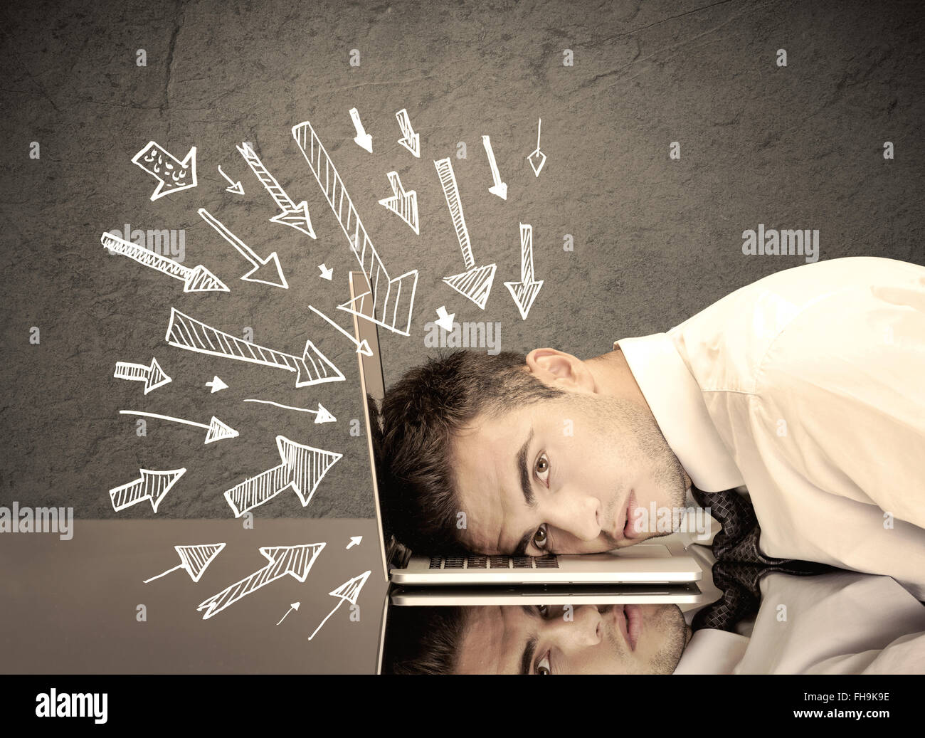 Arrows pointing at sad office worker Stock Photo - Alamy