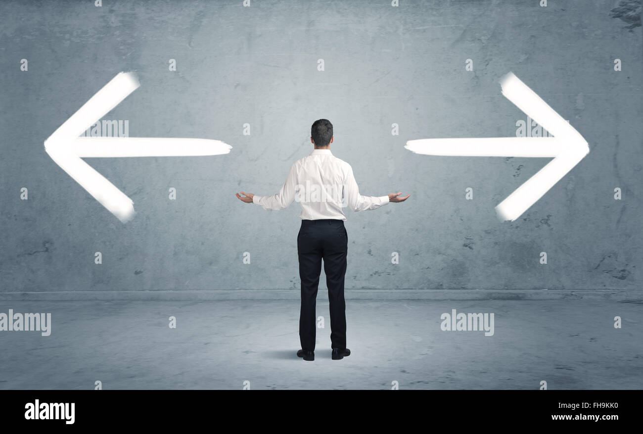 Confused business person choosing the way Stock Photo - Alamy