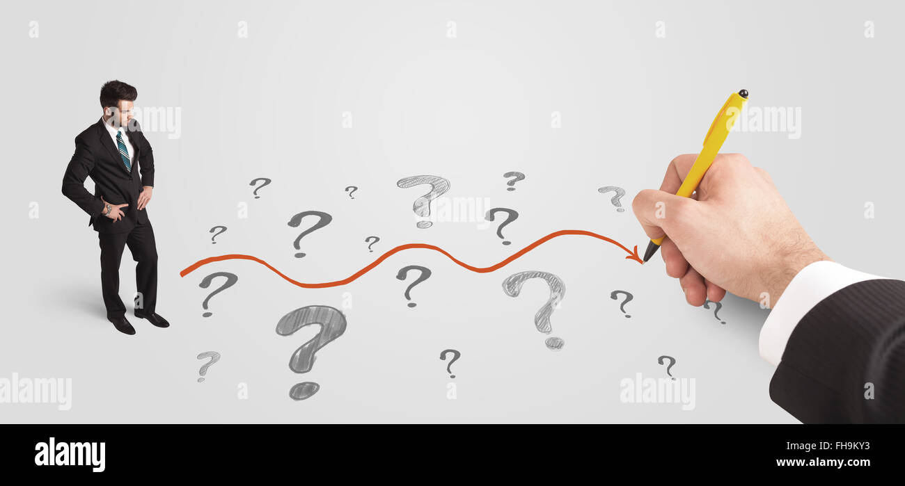 Business man looking at question marks and solution path Stock Photo ...