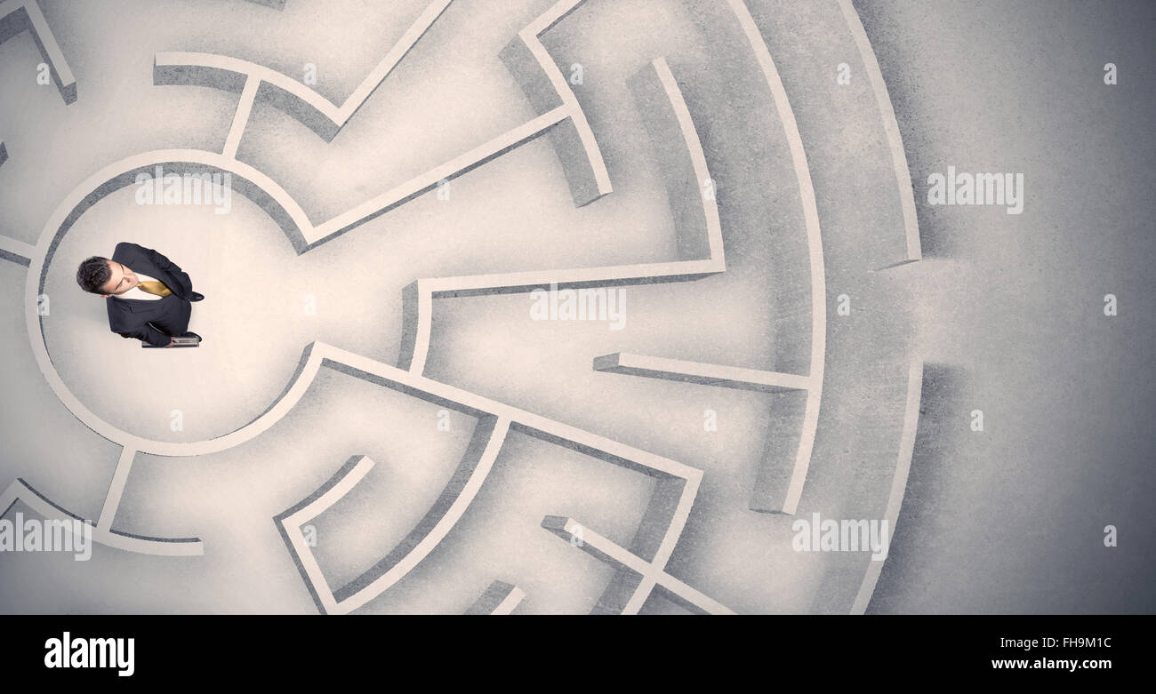 Business man trapped in a circular maze Stock Photo - Alamy