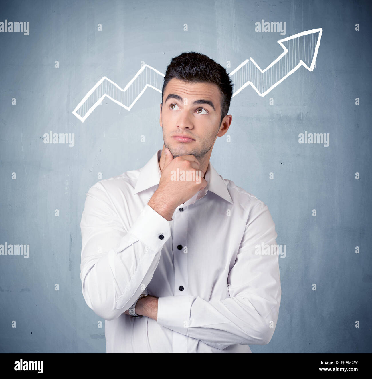 Smiling business guy with graph arrow Stock Photo - Alamy