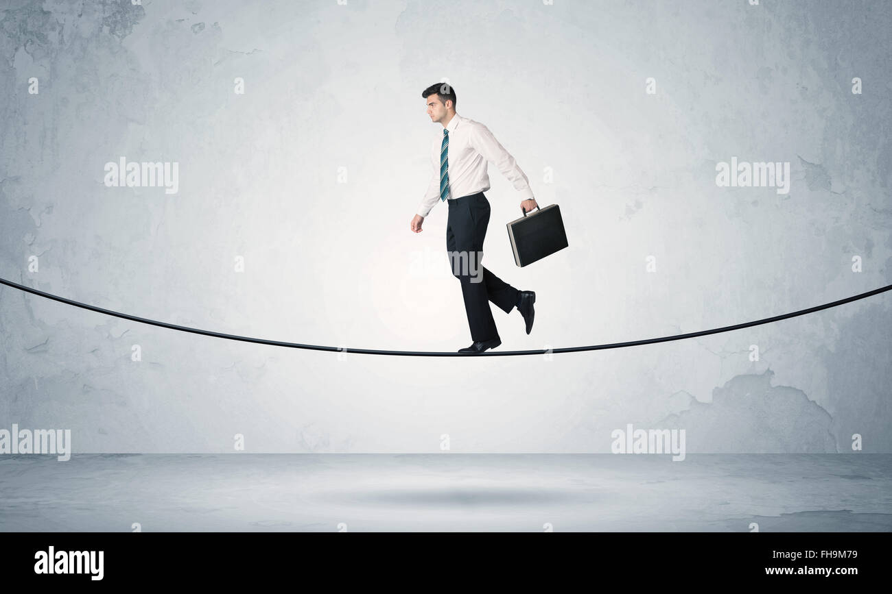 Businessman balancing on tightrope people hi-res stock photography and ...