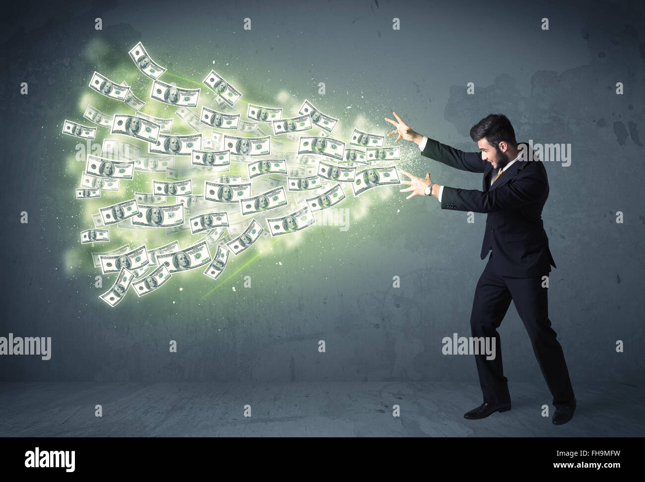 Handsome man throwing dollar hi-res stock photography and images - Alamy