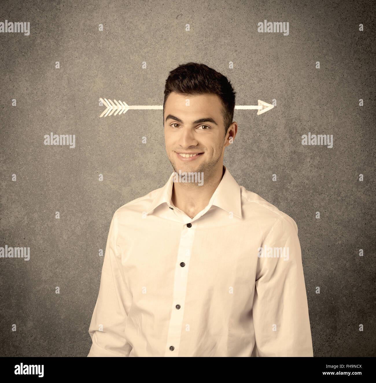 Young sales guy with arrow in the head Stock Photo - Alamy