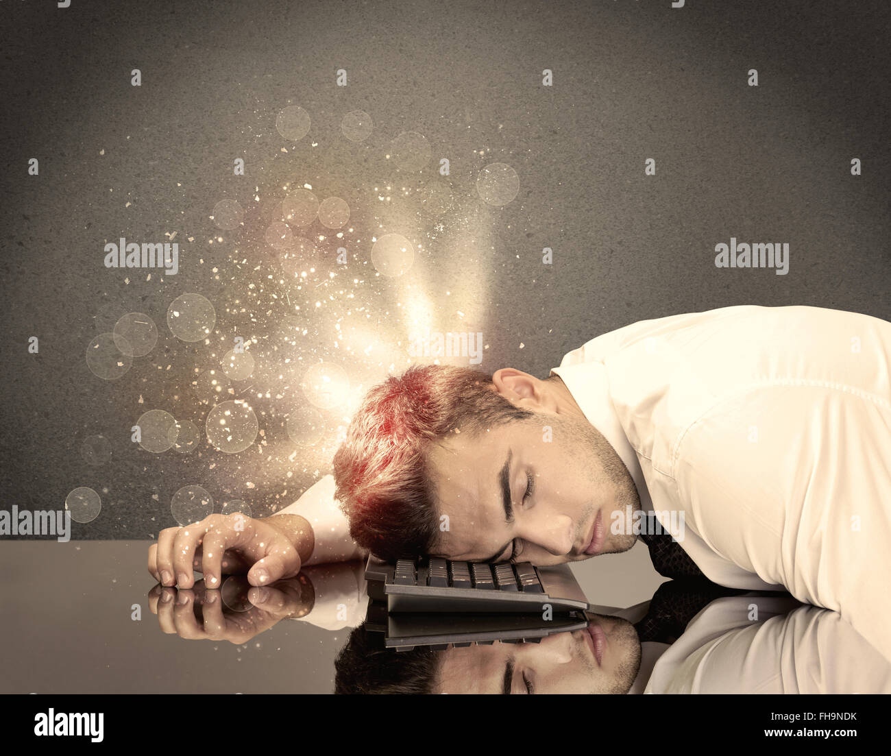 Angry businessman with lights and keyboard Stock Photo - Alamy
