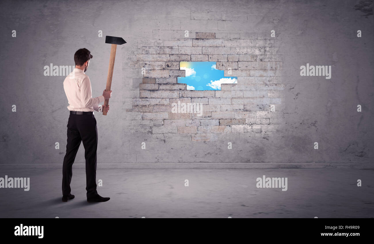 Business man hitting wall hammer hi-res stock photography and images ...