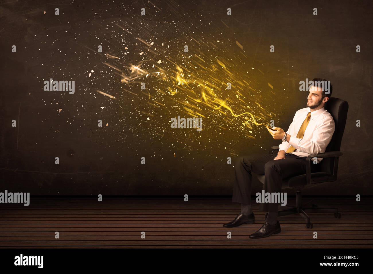 Businessman with tablet and energy explosion on background Stock Photo ...