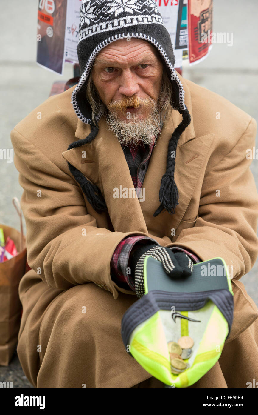 Elderly male panhandler on street corner in Chinatown-Victoria, British ...