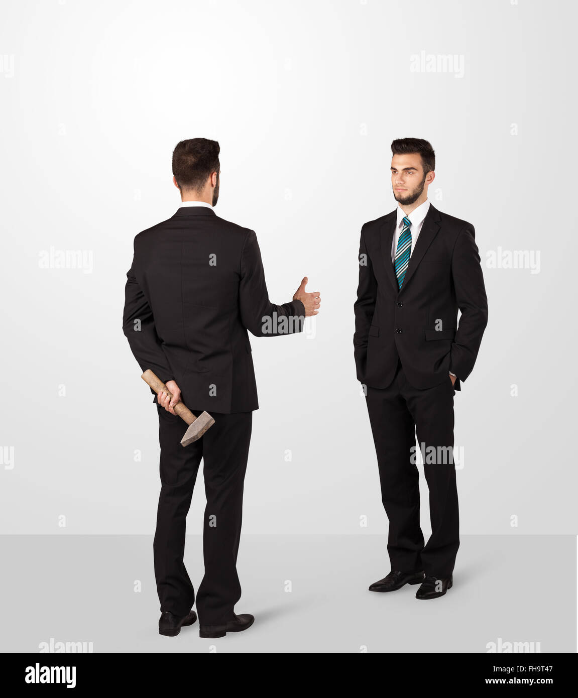 Two businessman shake hands Stock Photo - Alamy